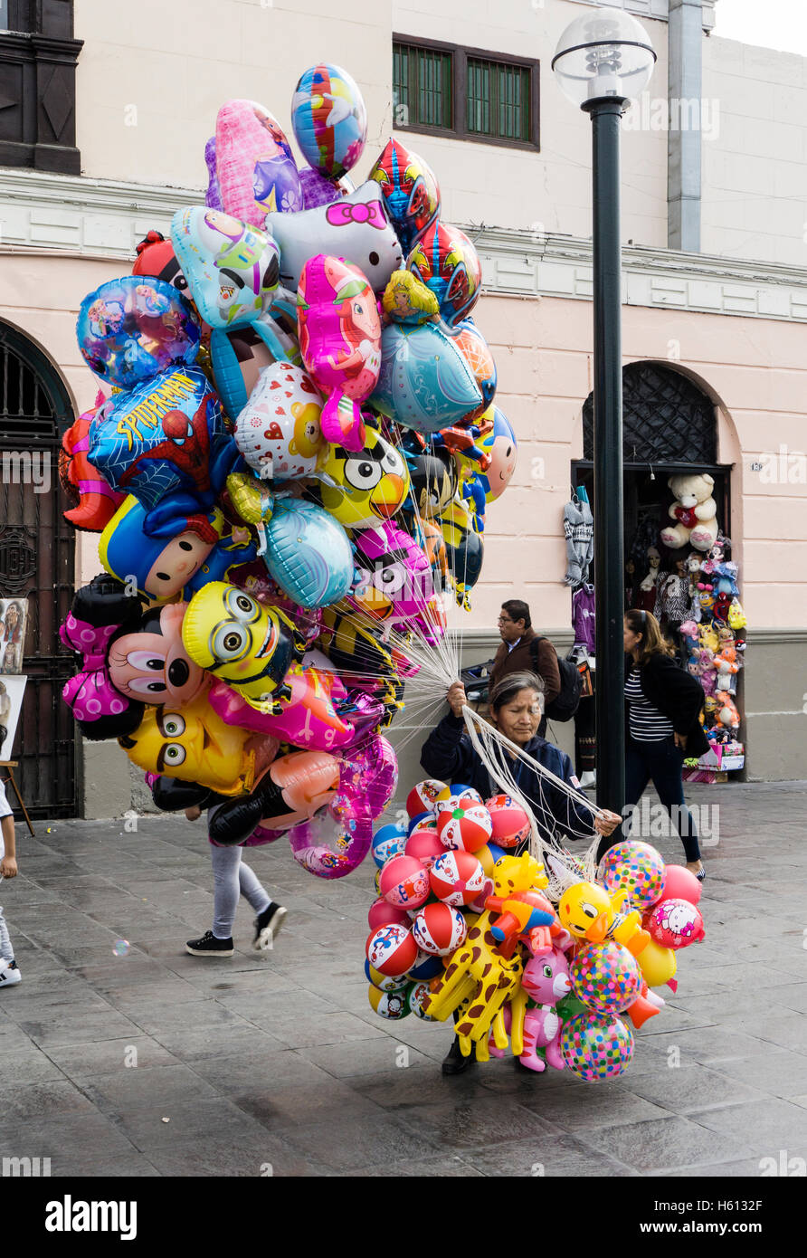 Selling balloons in the historic center of Lima city, Peru Stock Photo ...
