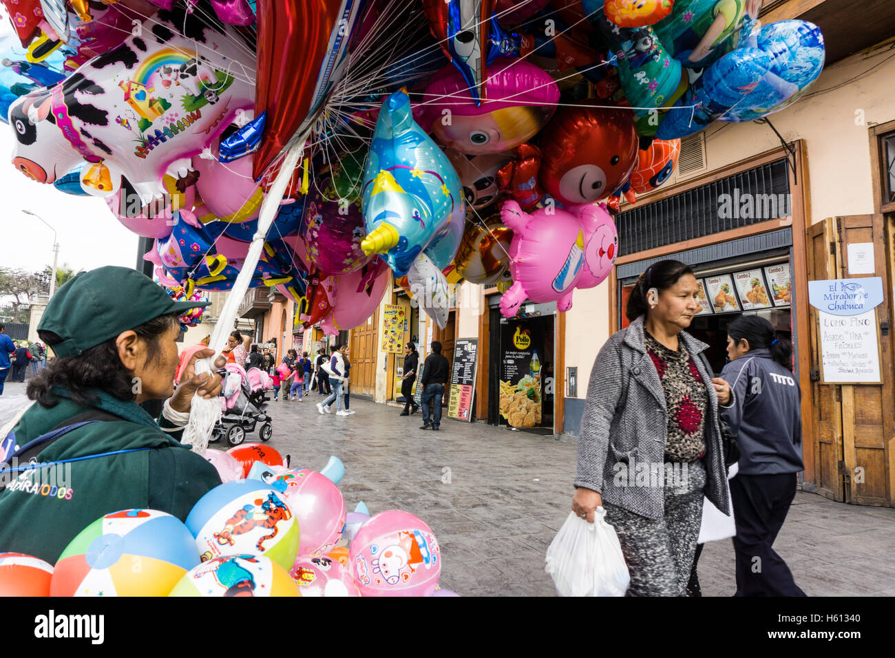 Selling balloons in the historic center of Lima city, Peru Stock Photo ...