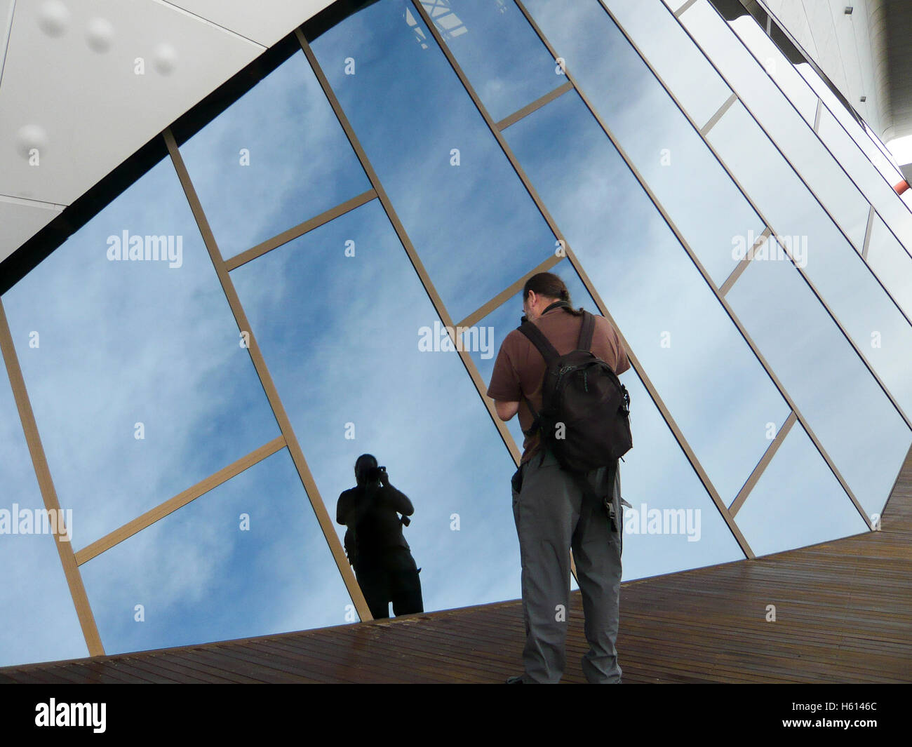 Man photographing his image reflected in window Stock Photo - Alamy