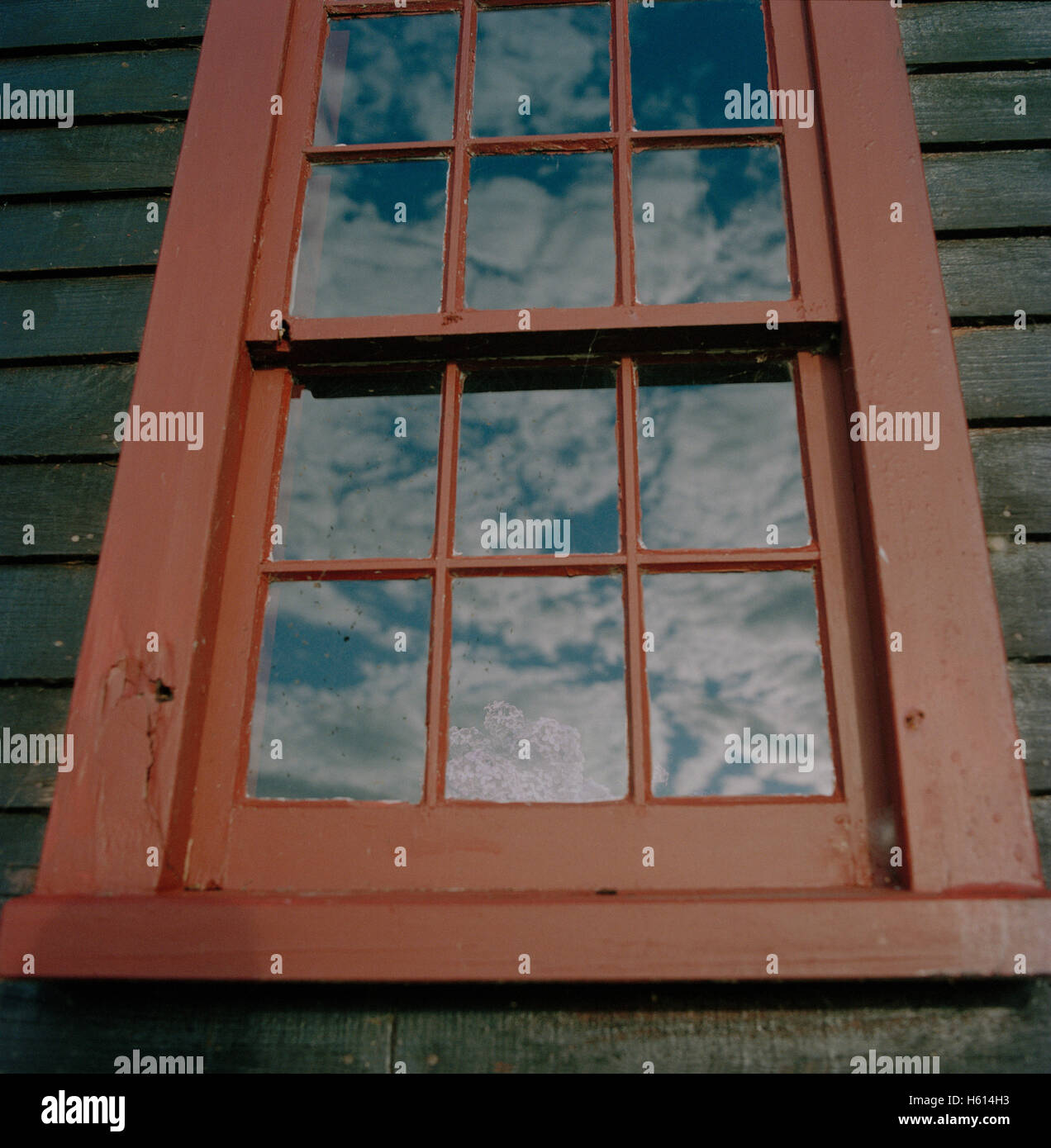 Red Window with Clouds & Sky Reflection Stock Photo - Alamy