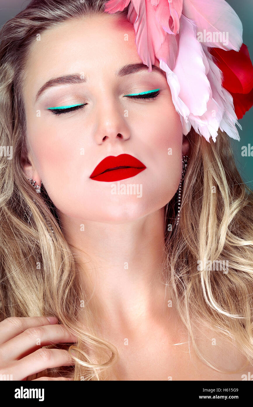 Closeup portrait of a beautiful woman with closed eyes with bright ...