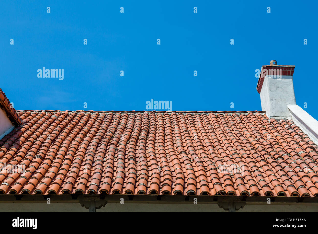 A red clay tile roof on a plaster hacienda Stock Photo - Alamy