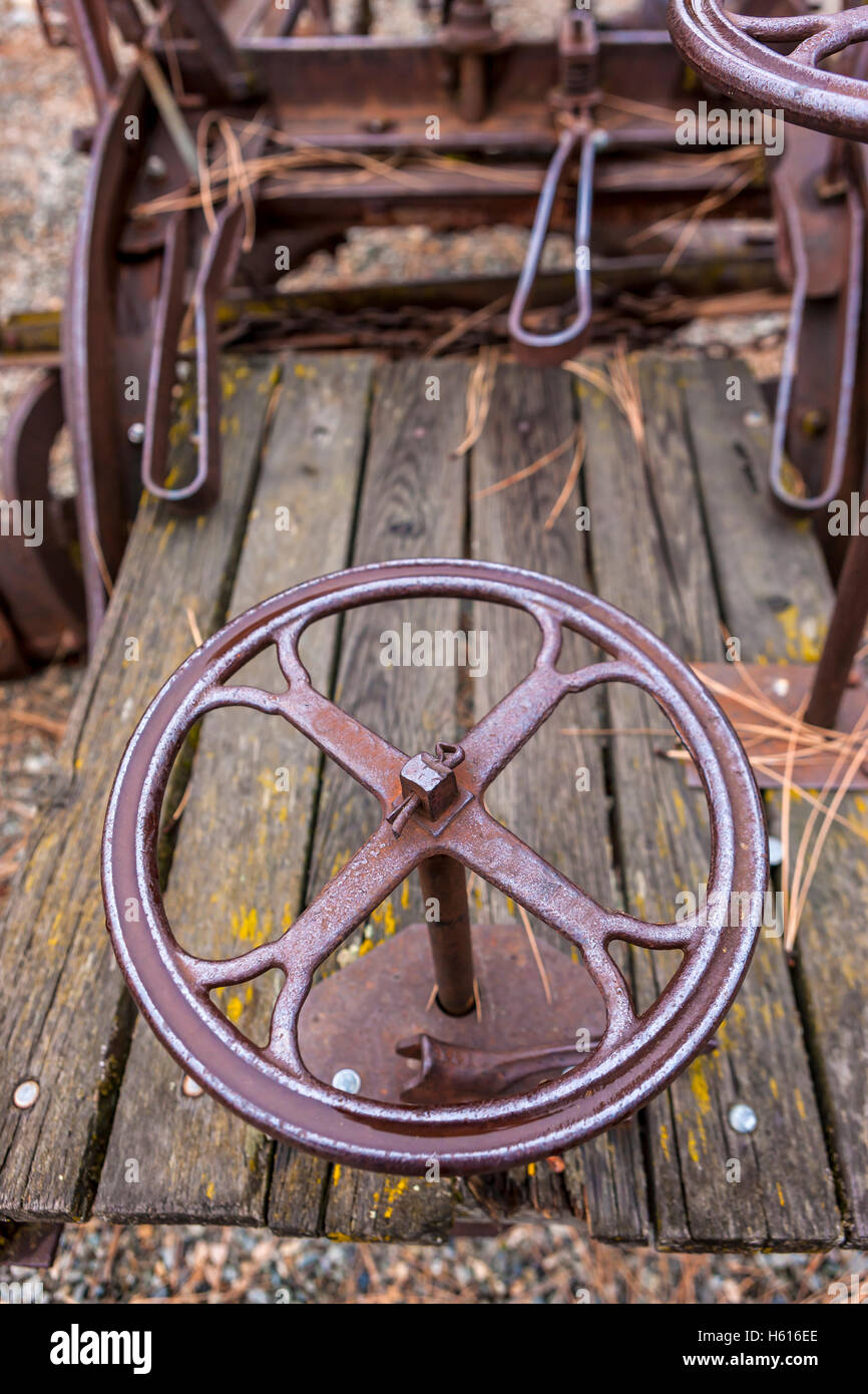 An old wheel on an antique machine at a museum in Winthrop, Washington ...
