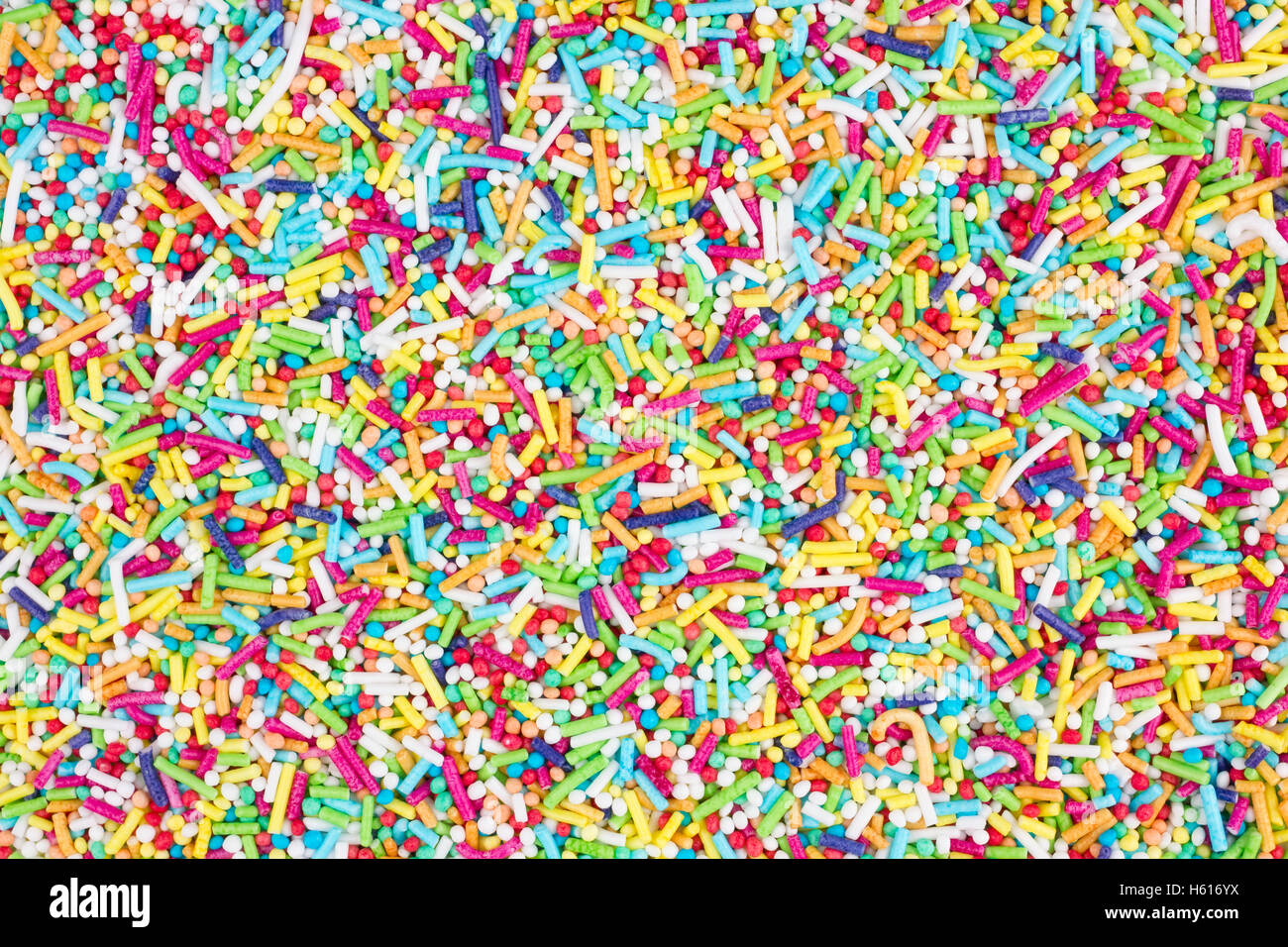 Sugar sprinkles glaze of all colors of the rainbow in the form of small ...