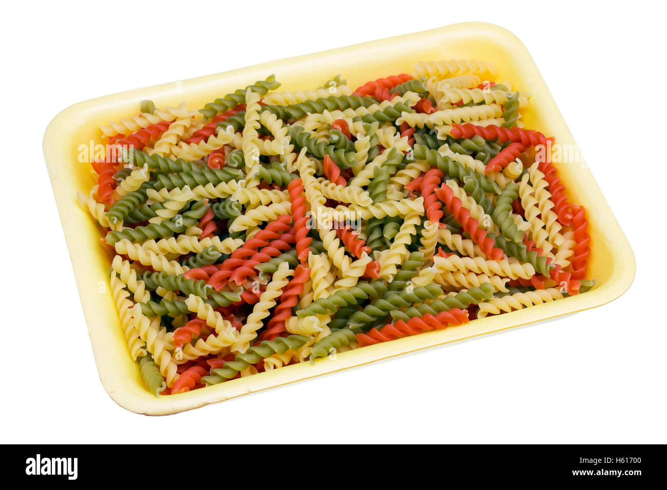 Isolated industrial plastic container with Italian macaroni pasta as ...