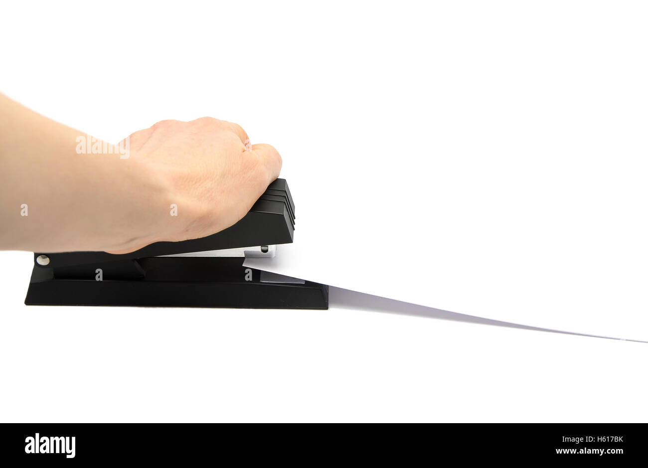 Stapler with sheet of paper Stock Photo - Alamy