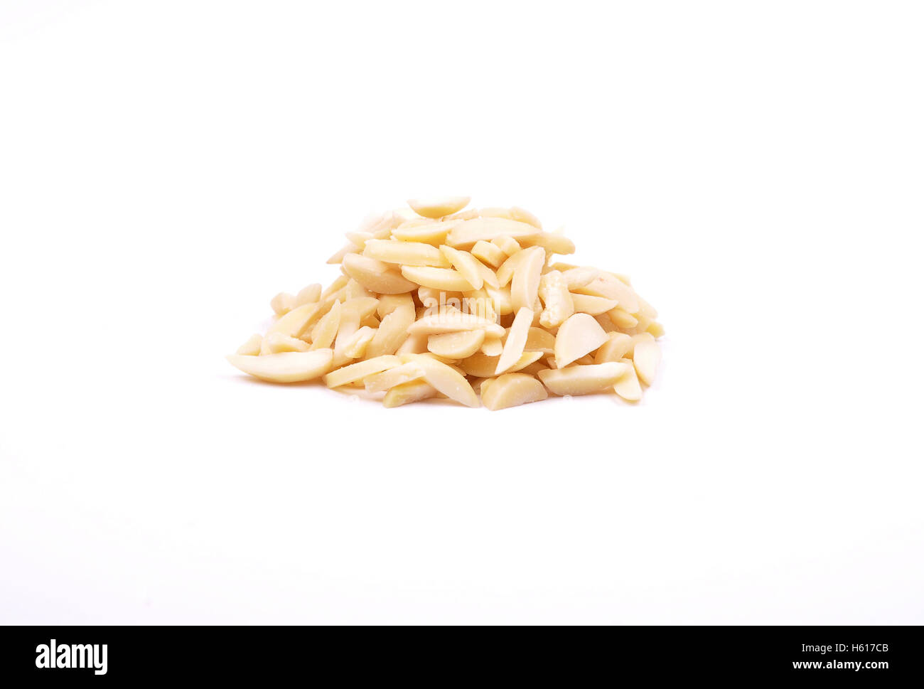 Almond slivers on white Stock Photo - Alamy