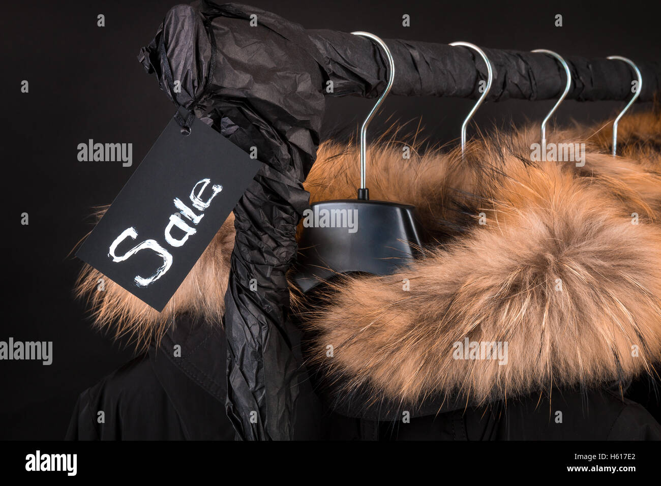 Coats hanging on a rack hi-res stock photography and images - Alamy