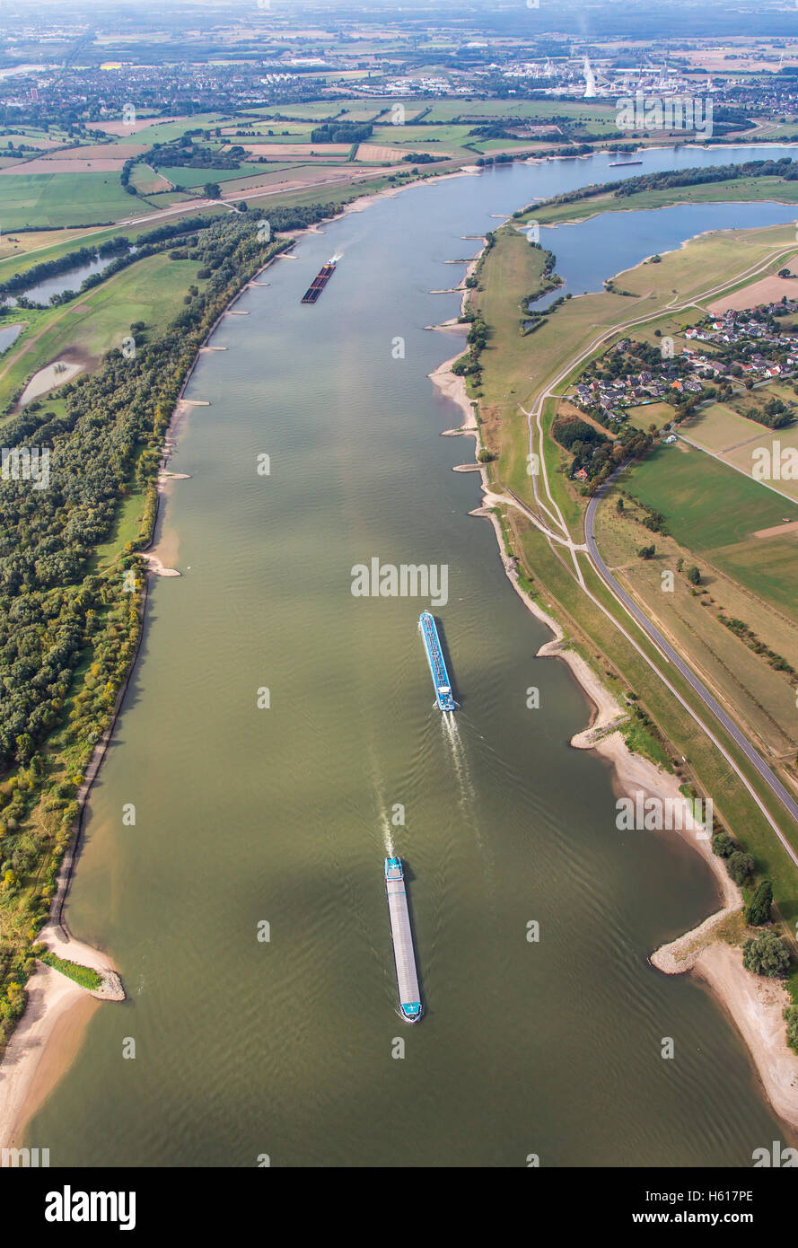 River Rhine, lower Rhine area, freight ships, cargo, flat landscape ...