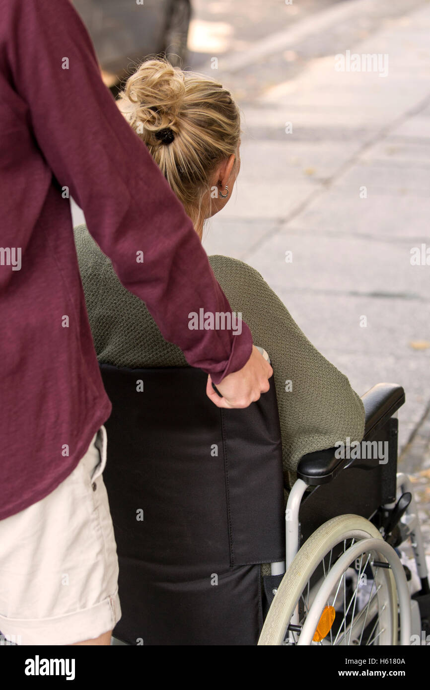 Helping someone street hi-res stock photography and images - Alamy