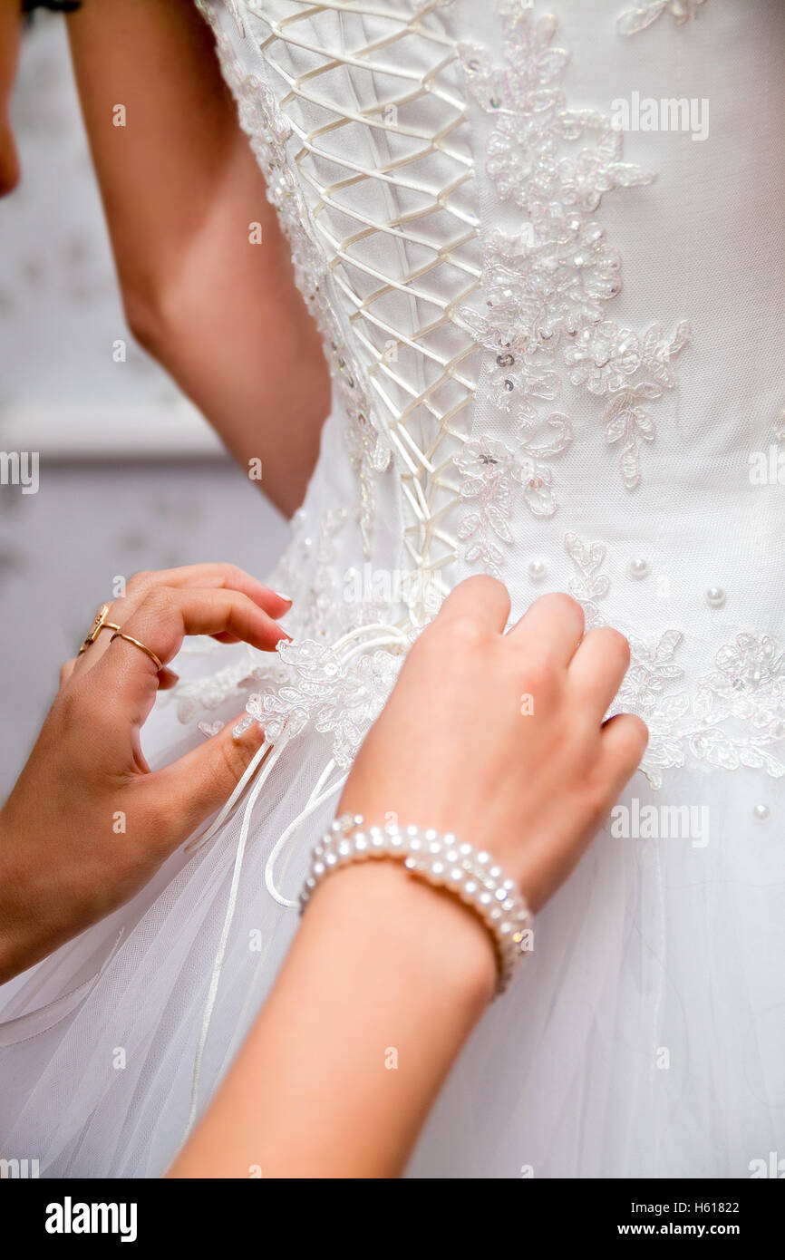 Buttoning bride's wedding dress. Close up. girl, fashion Stock Photo ...