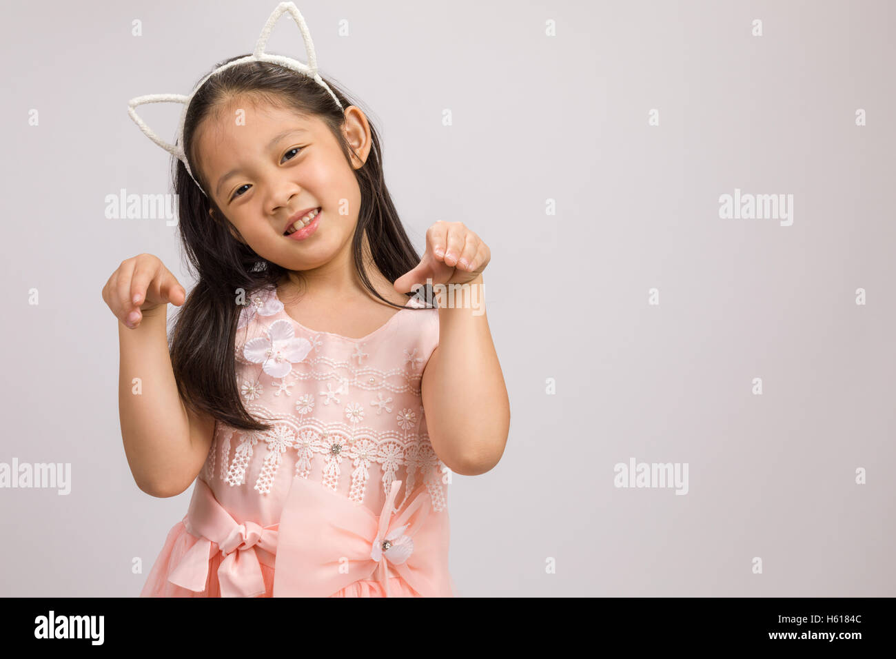 Kid with cat ear headband, isolated on white background Stock Photo - Alamy