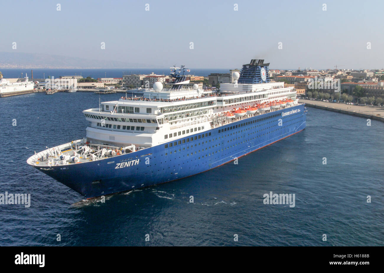 The cruise ship M.V. Zenith leaving the port of Messina in Sicily ...