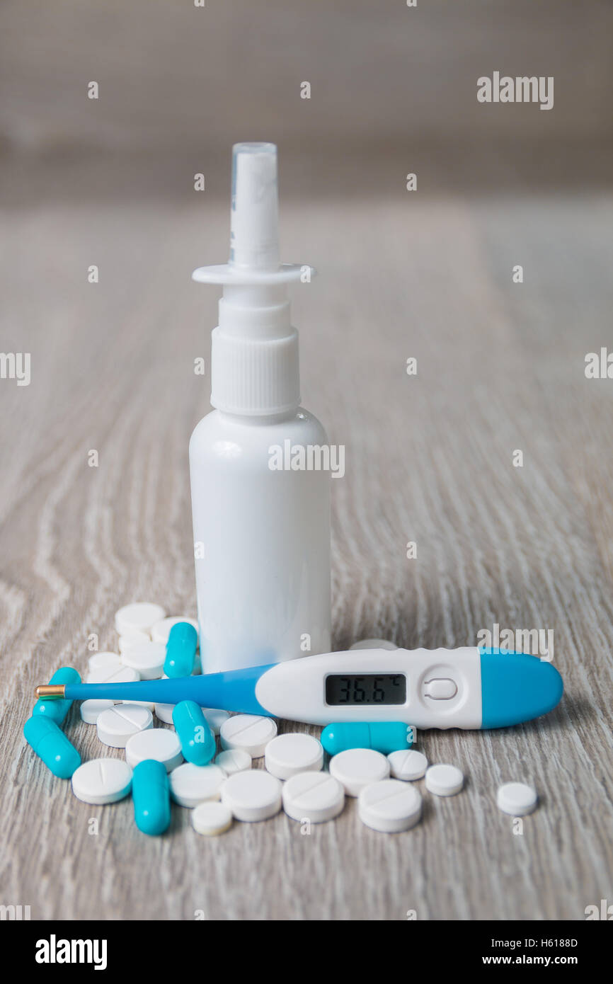 Blue and white medication, nasal spray, pills, vitamins, capsules ...