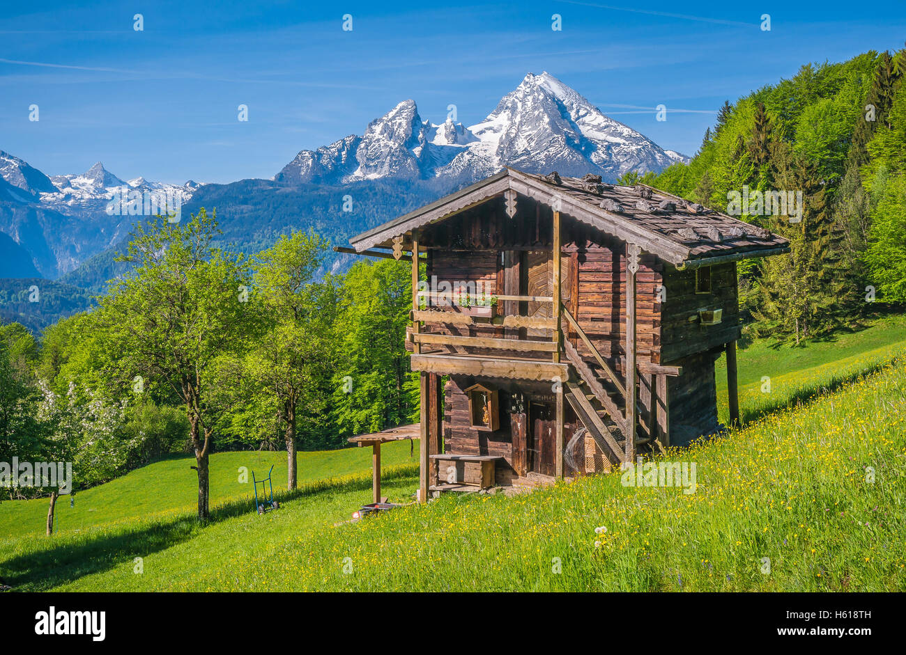 Idyllic mountain scenery with traditional mountain chalet in the Alps ...