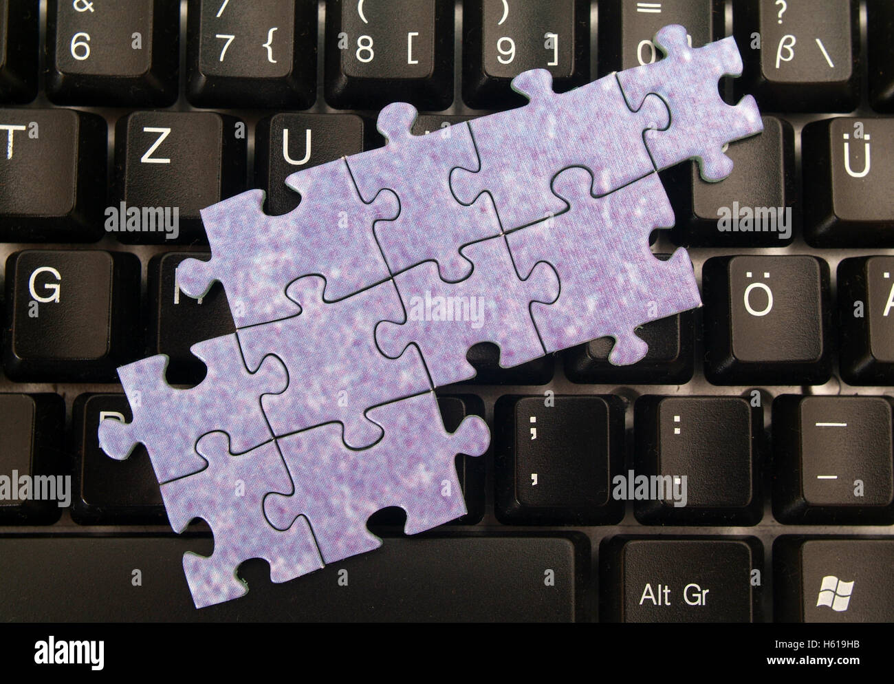 Puzzle on computer keyboard Stock Photo - Alamy