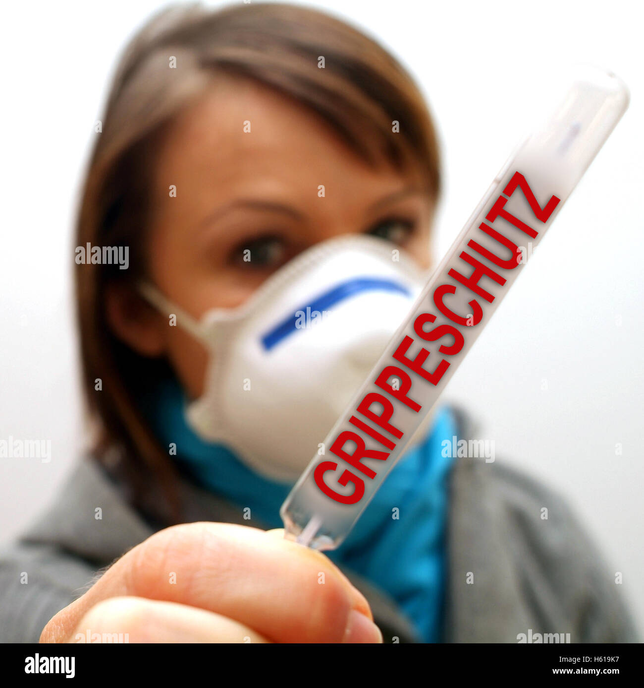 Symbolic for influenza prevention with protective mask Stock Photo - Alamy