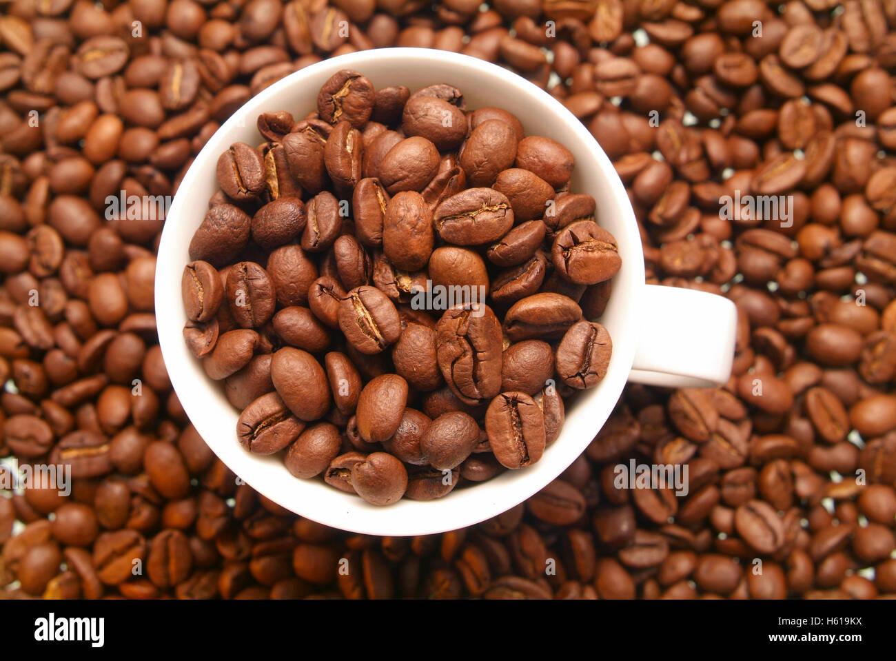 Coffee cup and coffee beans Stock Photo - Alamy