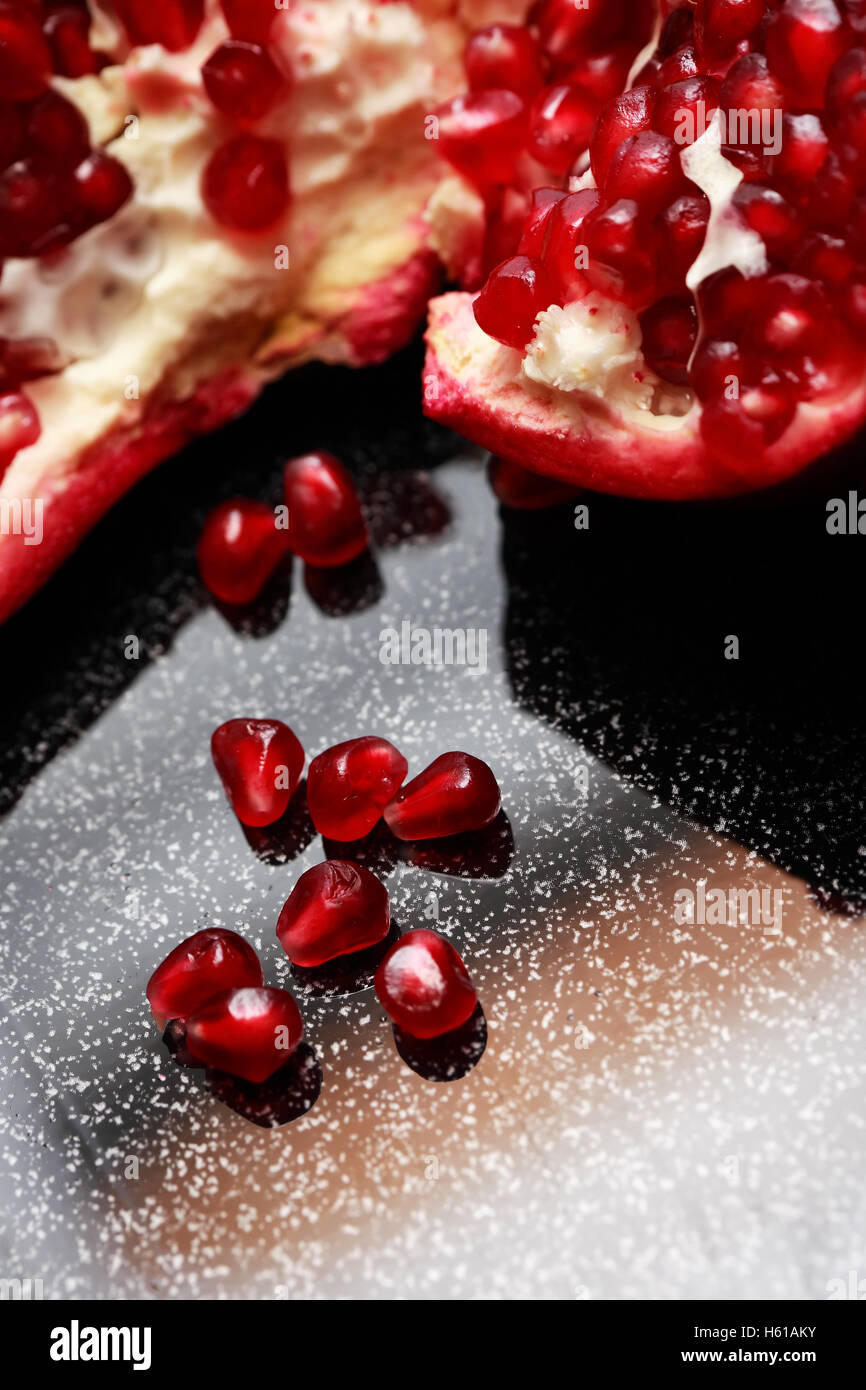 Closeup of freshness pomegranate near seed on dark background Stock ...