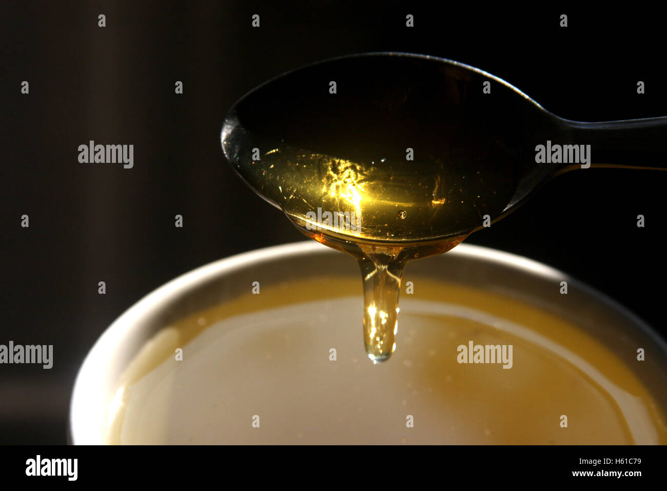 Spoon filled up with honey hi-res stock photography and images - Alamy