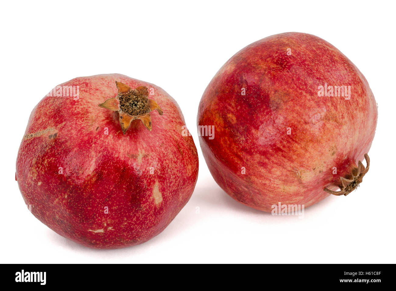 Two ripe pomegranate, isolated on white background Stock Photo - Alamy