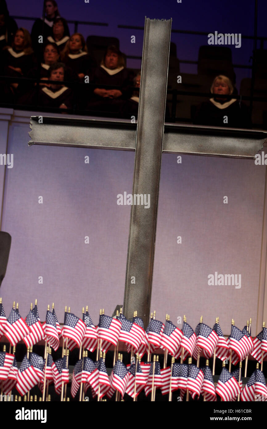 Display of American flags in church's sanctuary, with cross behind ...