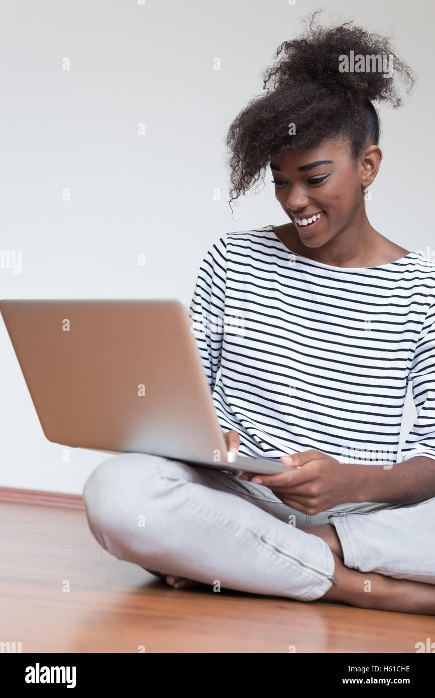 Black African American student girl using a laptop Stock Photo - Alamy