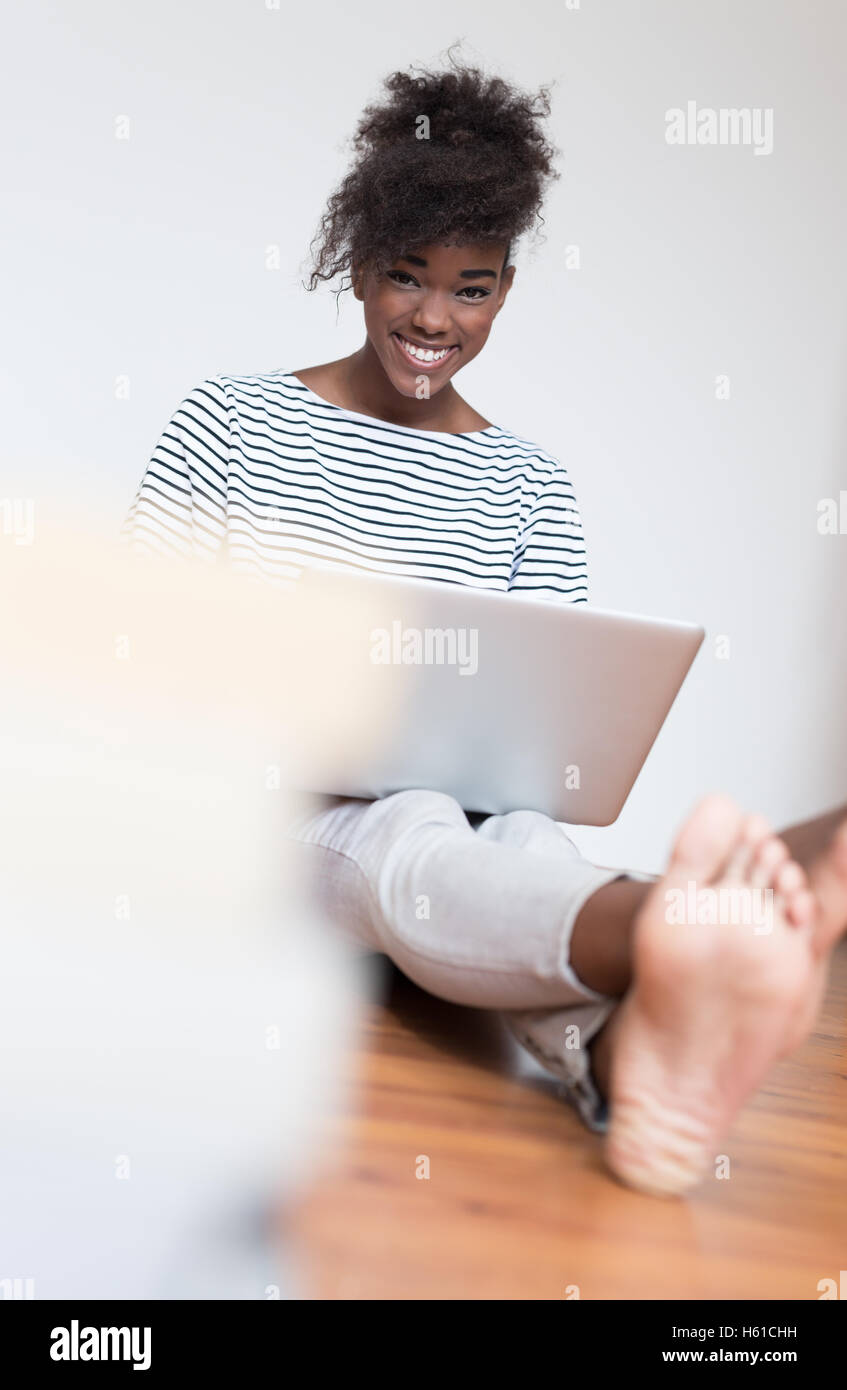 Black African American student girl using a laptop Stock Photo - Alamy