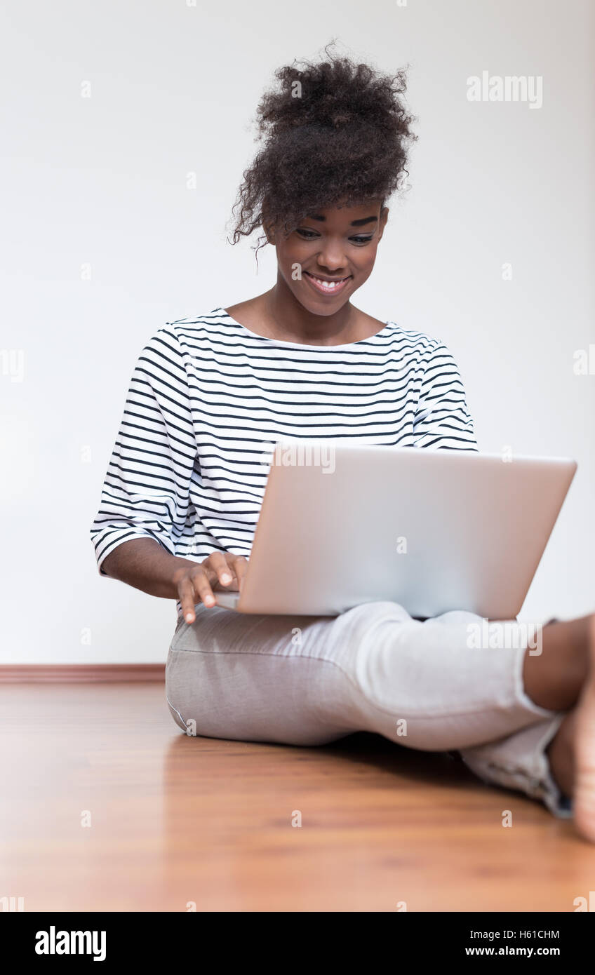 Black African American student girl using a laptop Stock Photo - Alamy