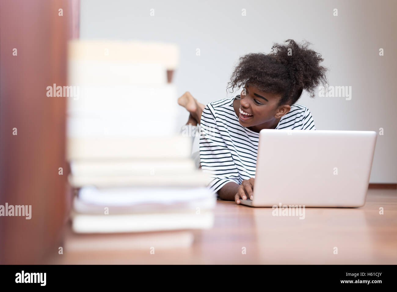 Black African American student girl using a laptop Stock Photo - Alamy