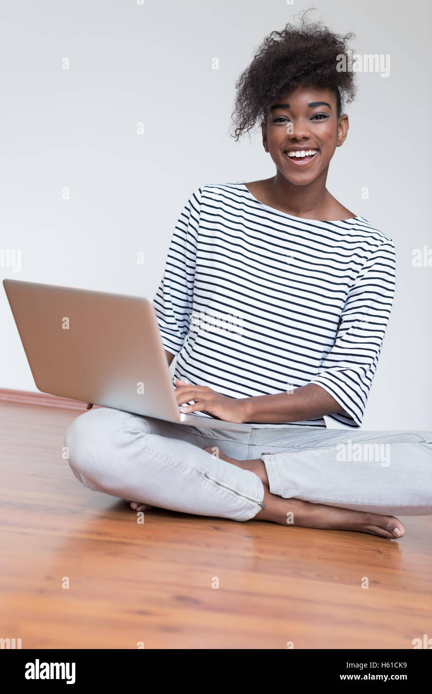 Black African American student girl using a laptop Stock Photo - Alamy
