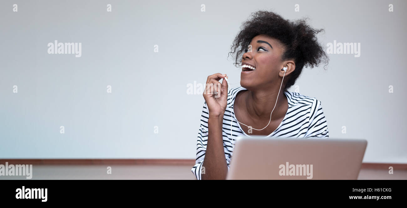 Black African American student girl using a laptop Stock Photo - Alamy