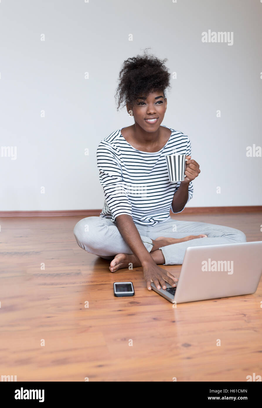 Black African American student girl using a laptop Stock Photo - Alamy