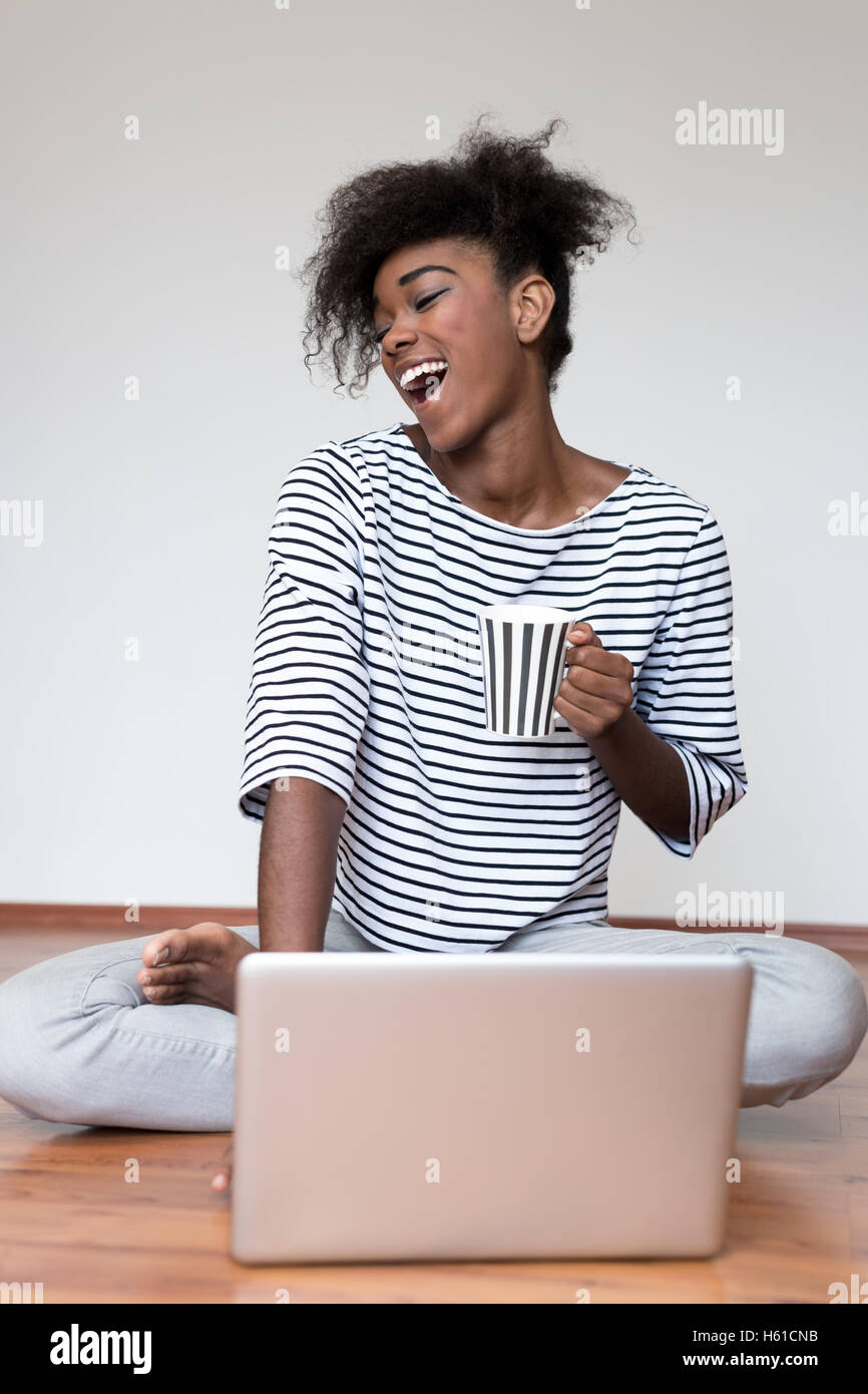 Black African American student girl using a laptop Stock Photo - Alamy