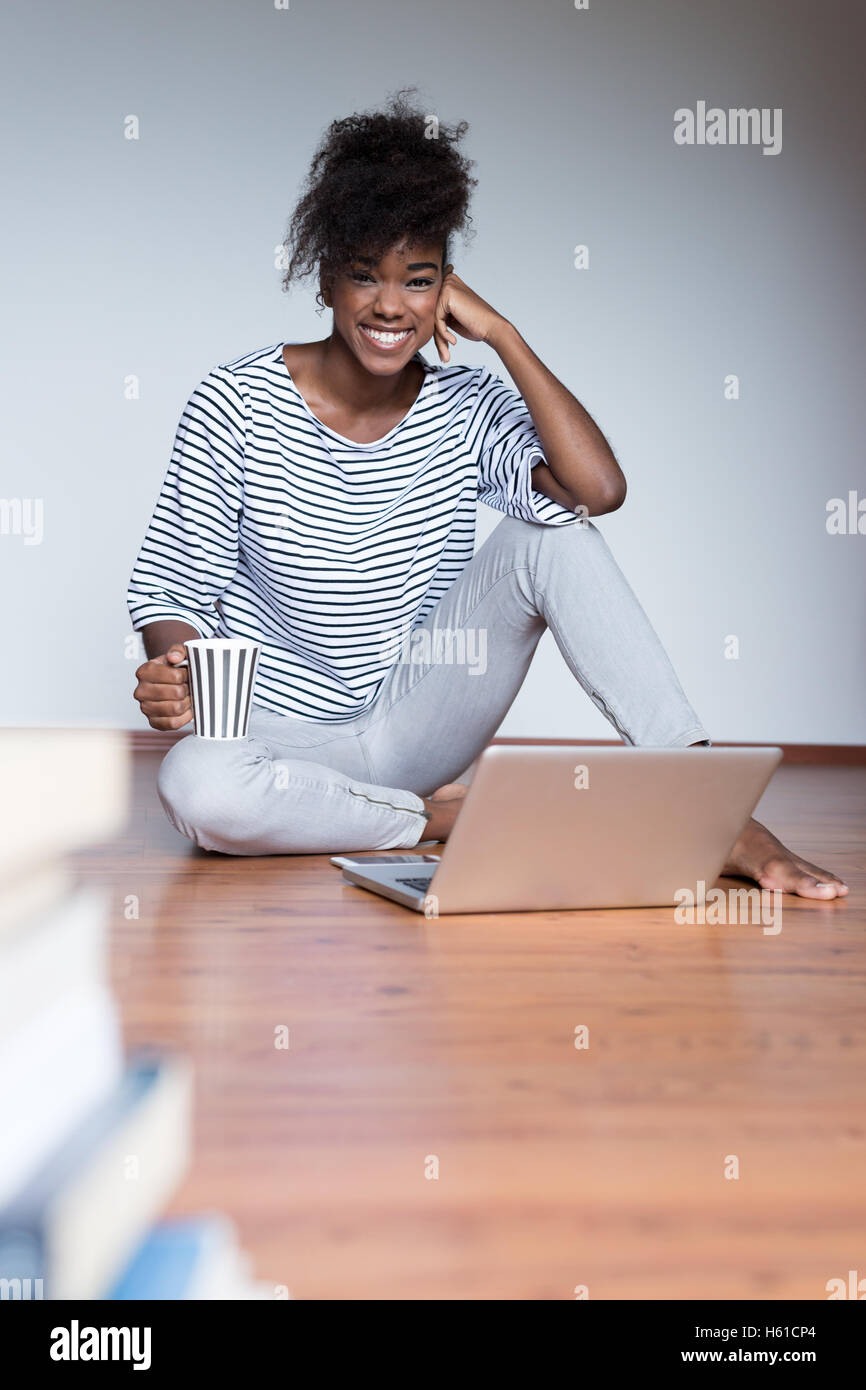 Black African American student girl using a laptop Stock Photo - Alamy