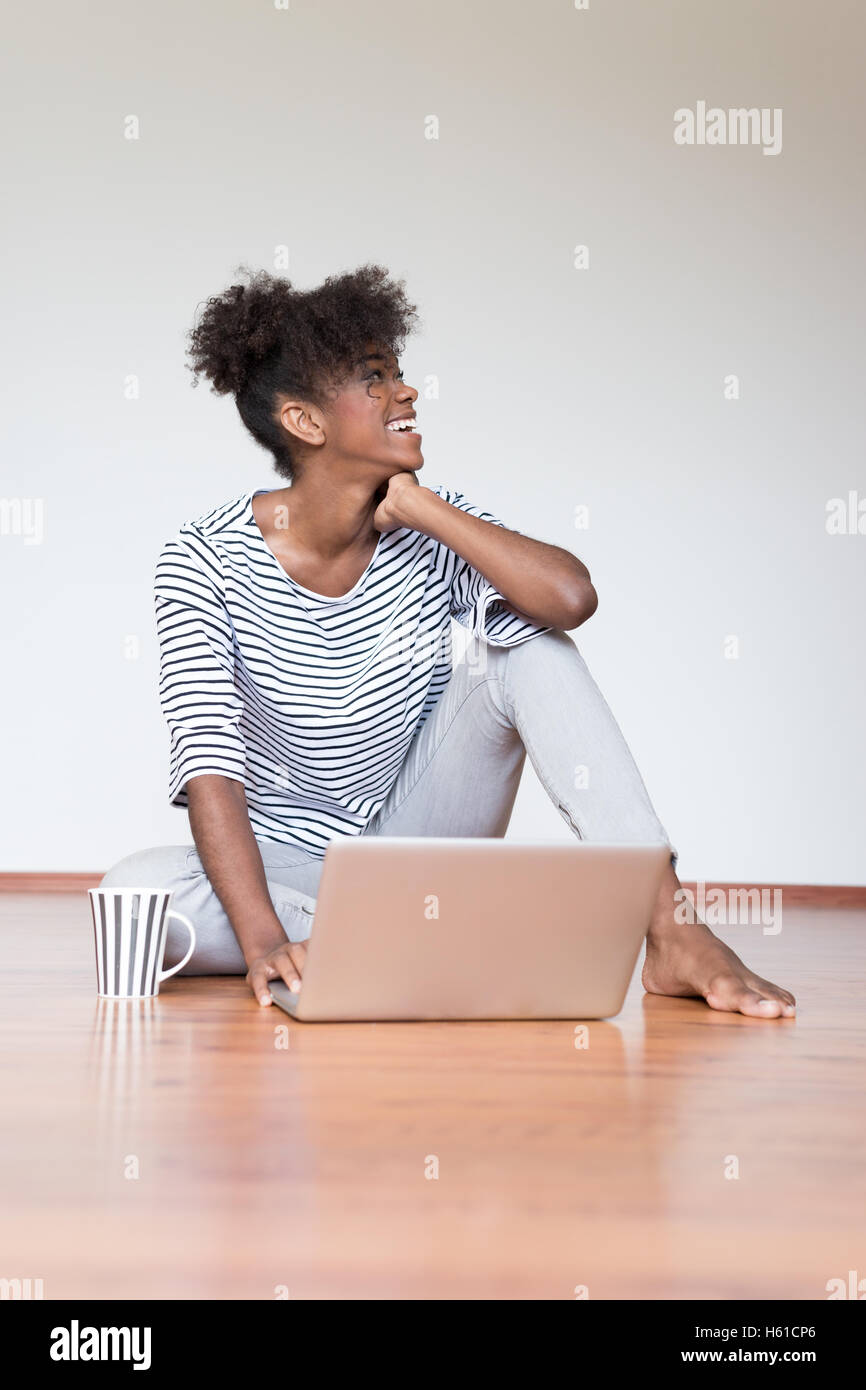 Black African American student girl using a laptop Stock Photo - Alamy