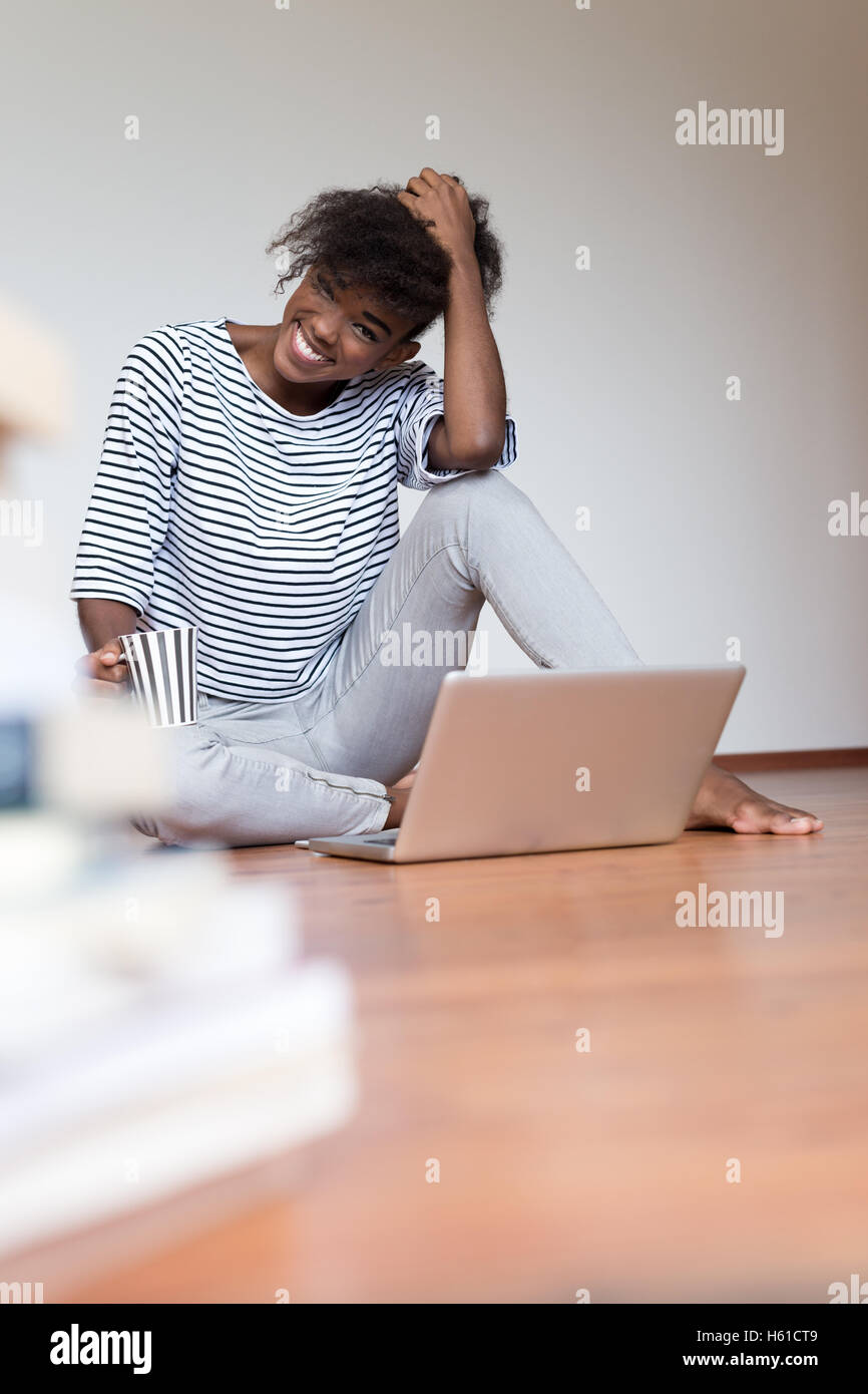 Black African American student girl using a laptop Stock Photo - Alamy