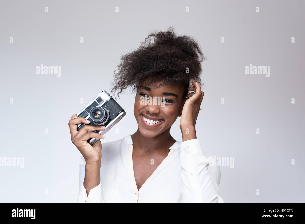 retty young girl holding a vintage camera Stock Photo - Alamy