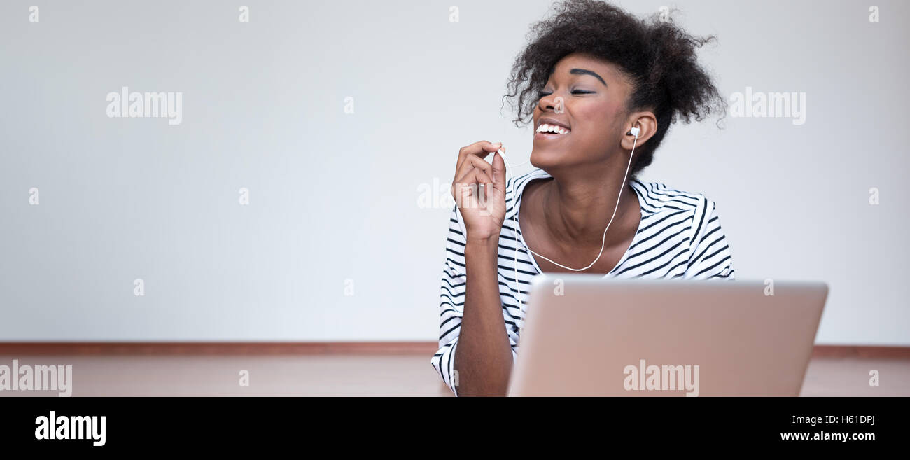 Happy African American woman with a lovely frizzy afro hairdo lying on ...