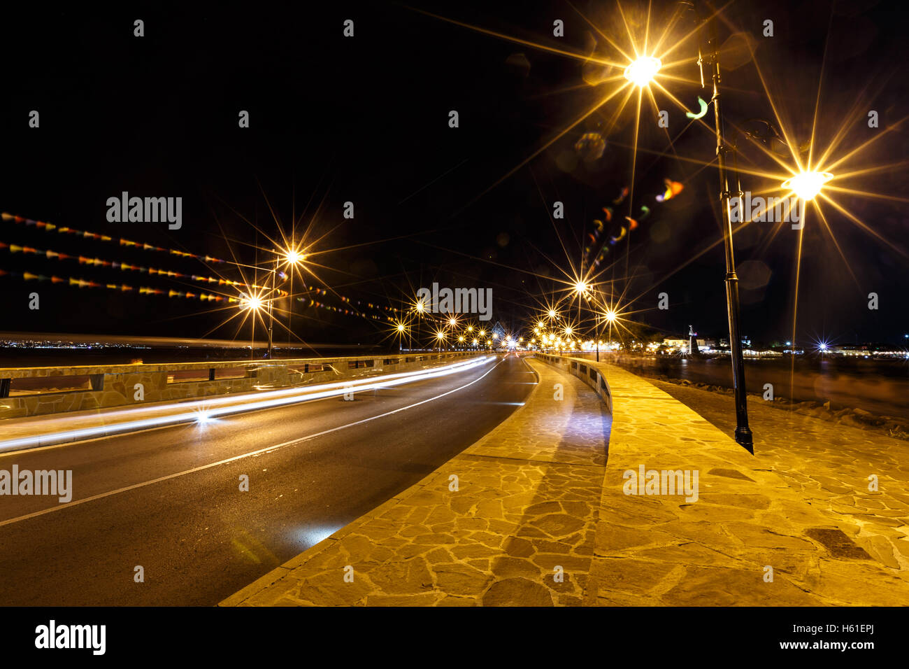 Night bridge with road in Nessebar lit lanterns Stock Photo - Alamy