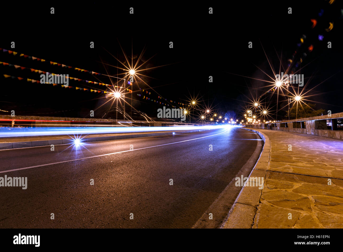 Night bridge with road in Nessebar lit lanterns Stock Photo - Alamy