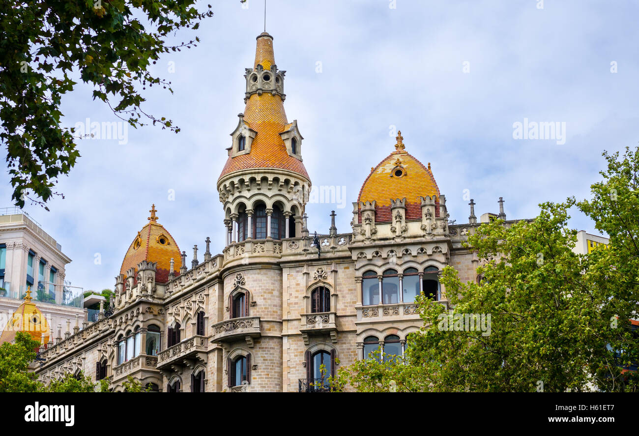 Cases Antoni Rocamora building with orange roofs in Barcelona, Spain ...