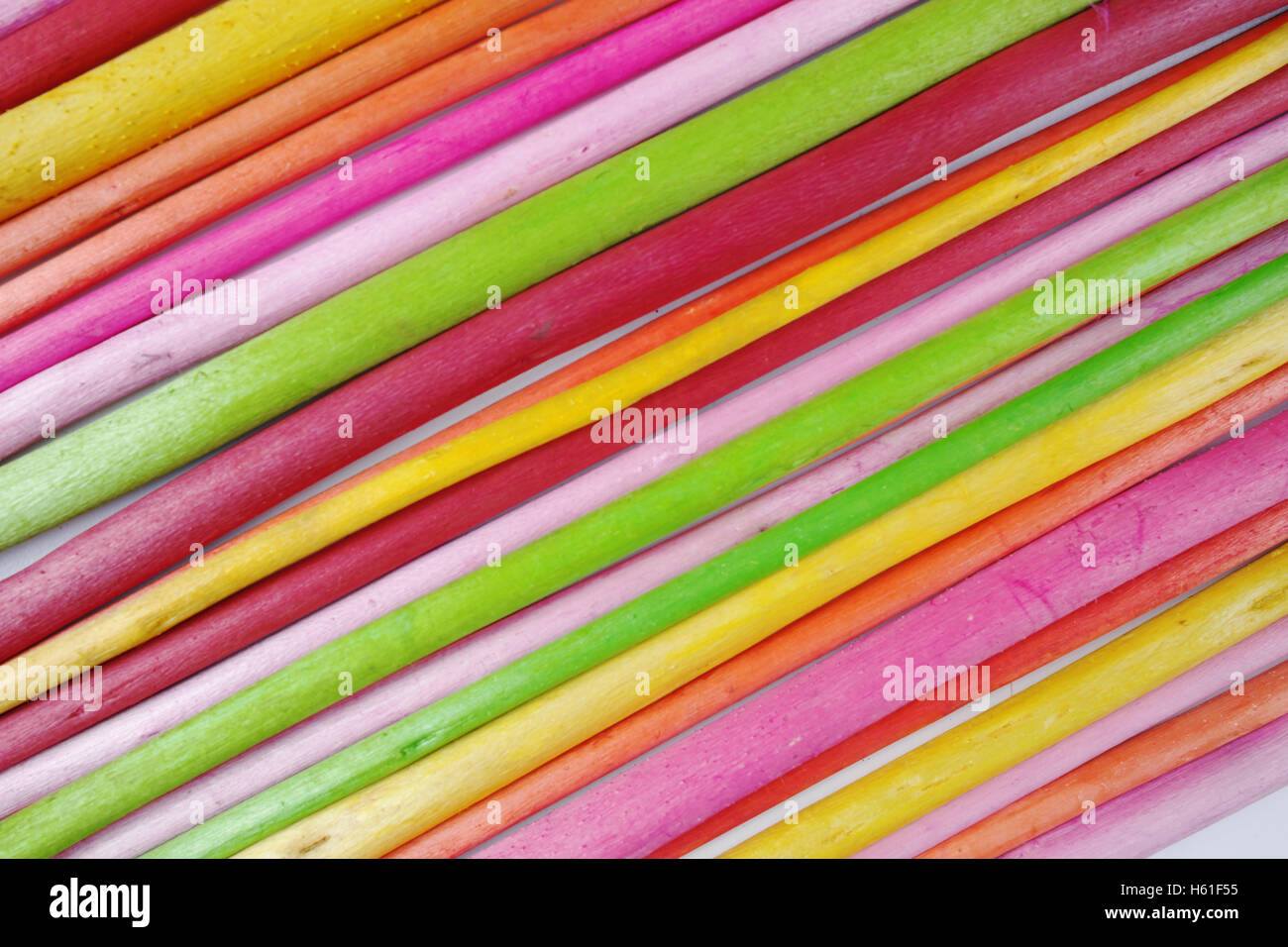 Decorative colorful wooden sticks on white background Stock Photo - Alamy