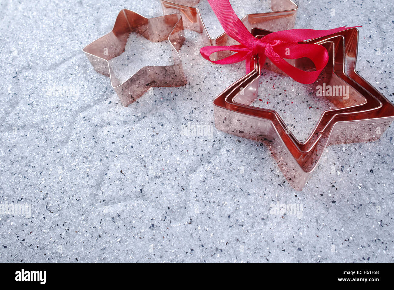 Copper star-shaped cookies cutter on shiny mirrored background Stock ...
