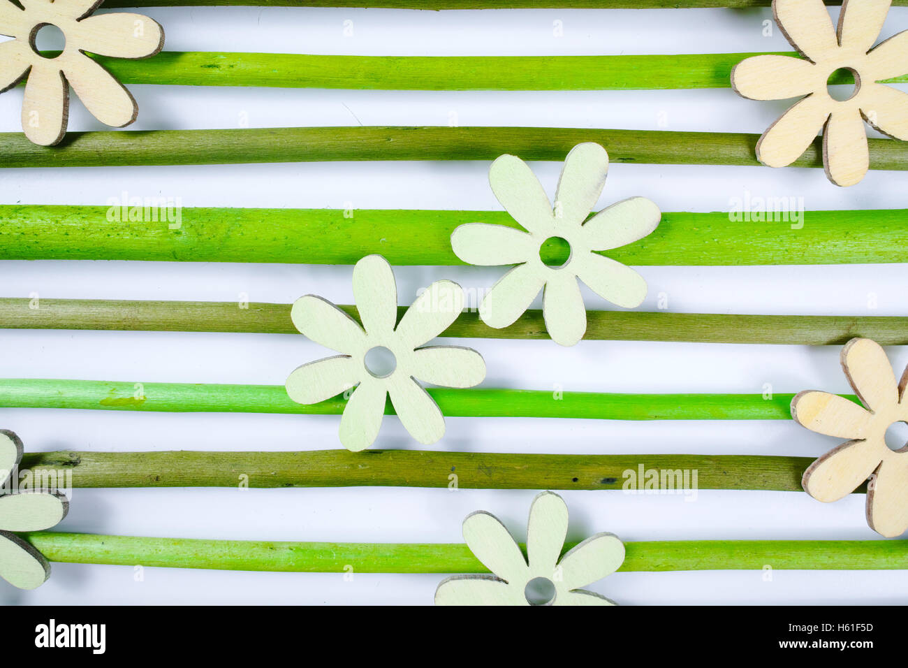 Decorative colorful wooden sticks with flowers background Stock Photo ...