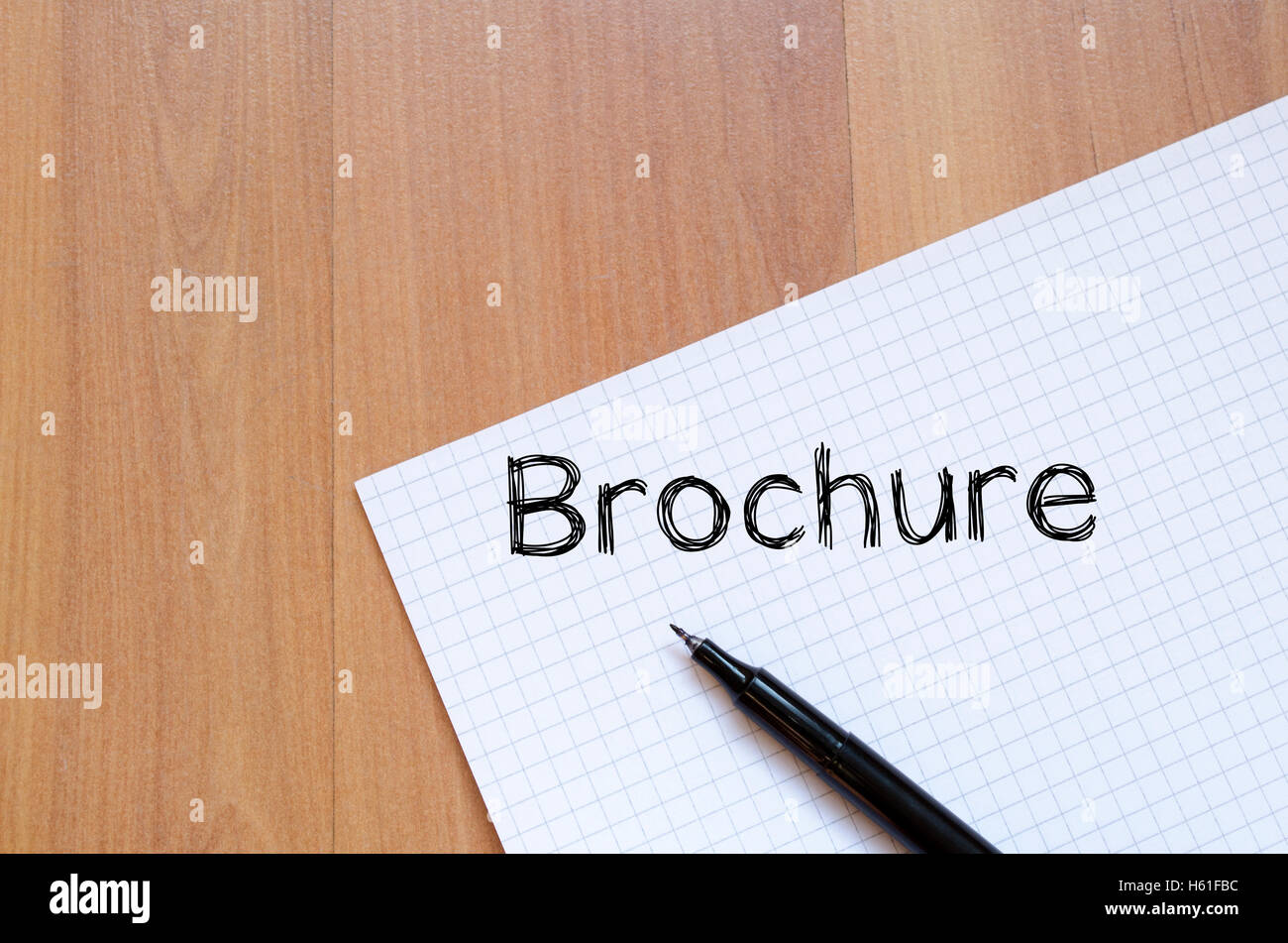 Brochure text concept write on notebook Stock Photo - Alamy