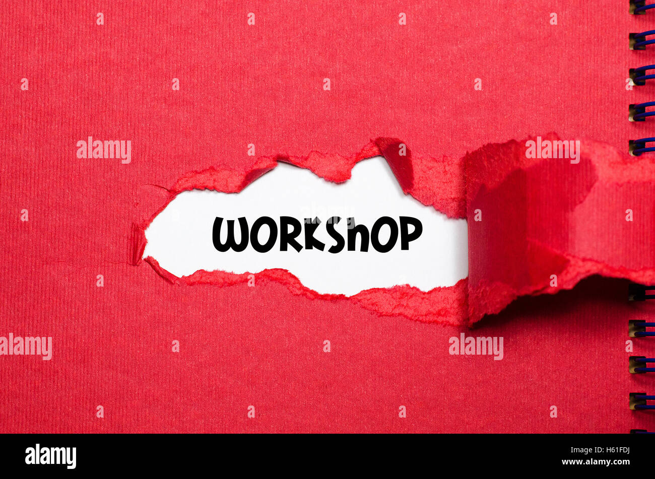 The word workshop appearing behind torn paper Stock Photo - Alamy