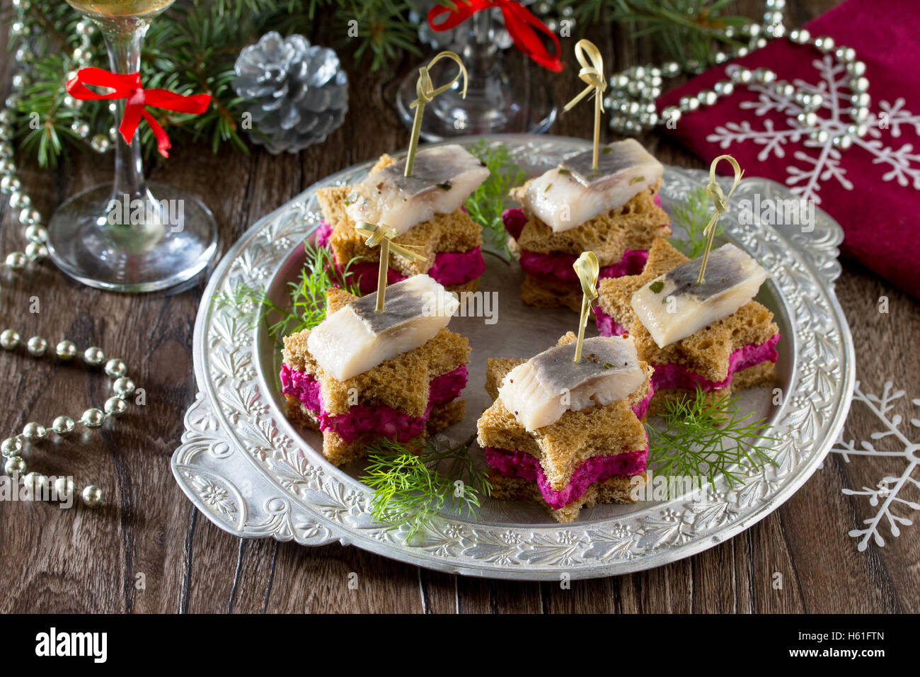 Holiday appetizer: Canapes in the form of a star with pickled herring ...