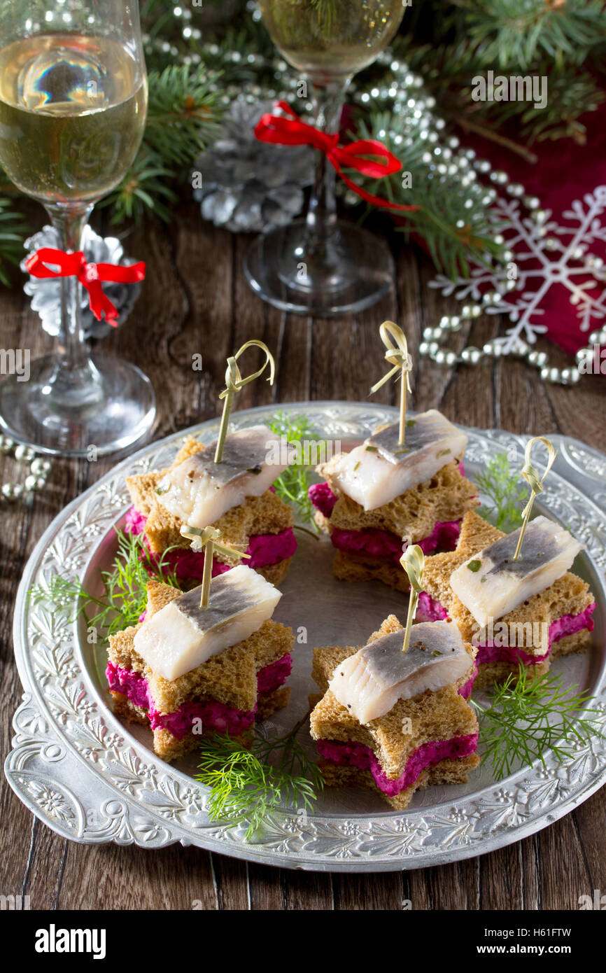 Holiday appetizer: Canapes in the form of a star with pickled herring ...