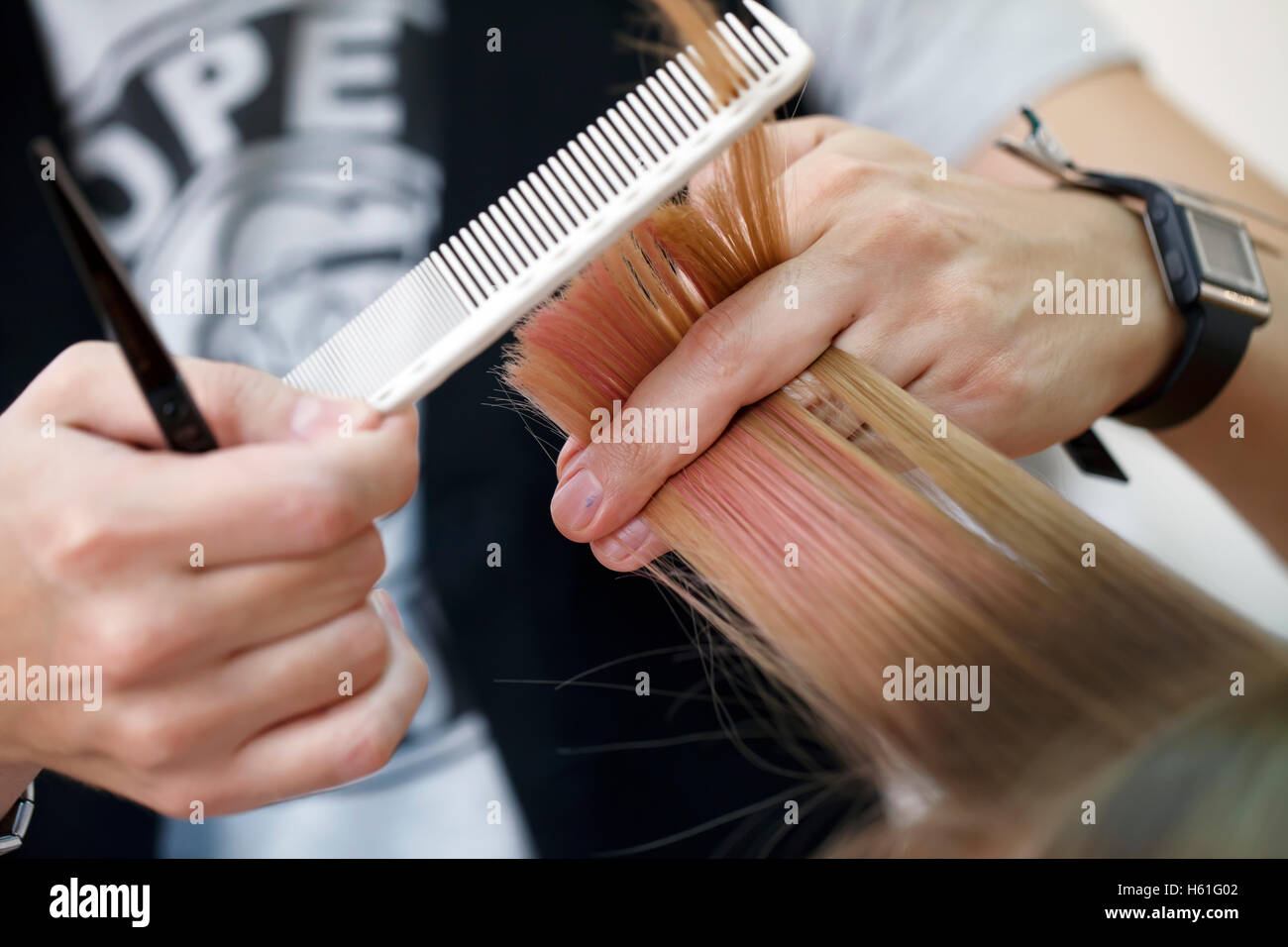 Female barber haircut doing male hi-res stock photography and images ...
